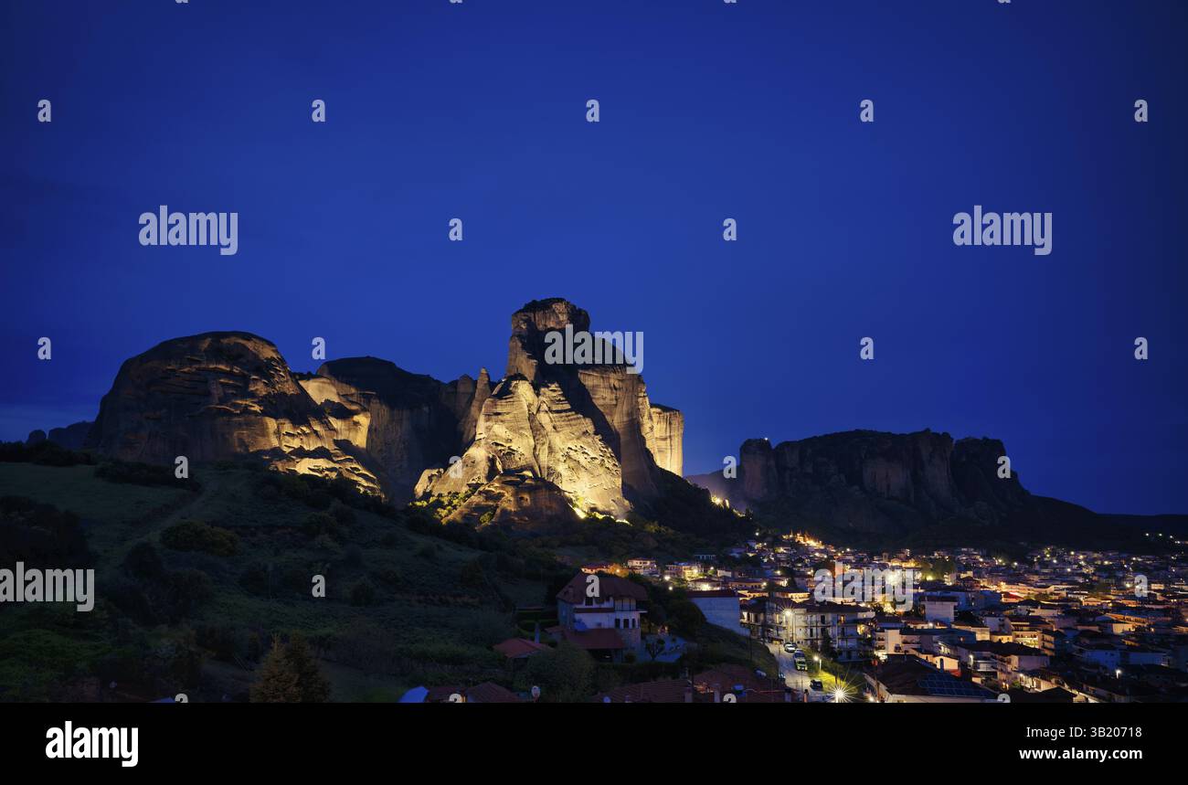 Night shot, village at Kalambaka at the foot of the Meteora mountains ...