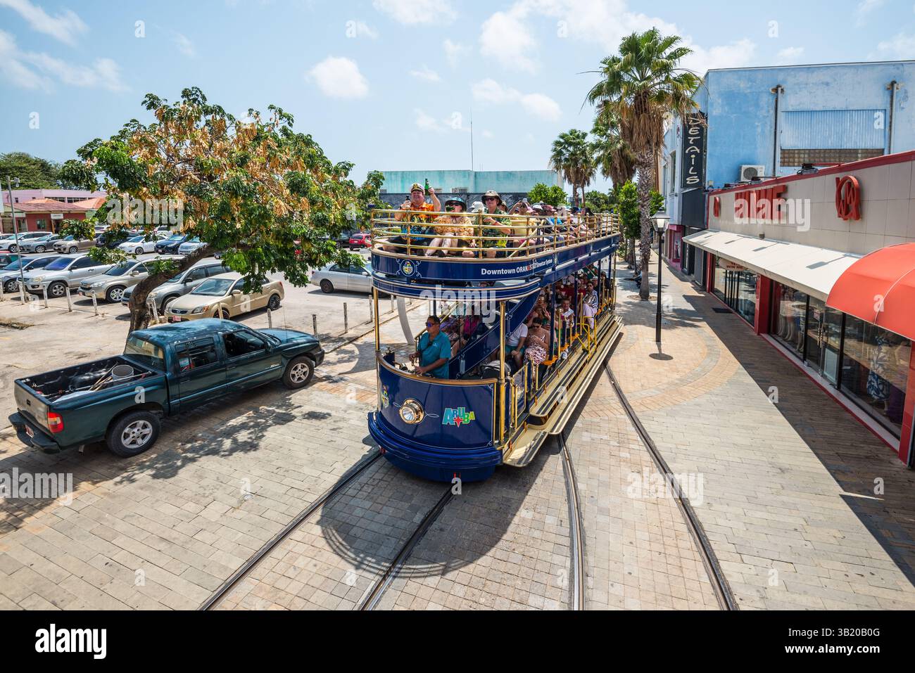 Oranjestad, Aruba - April 11, 2024: Happy tourists ride a double-decker ...