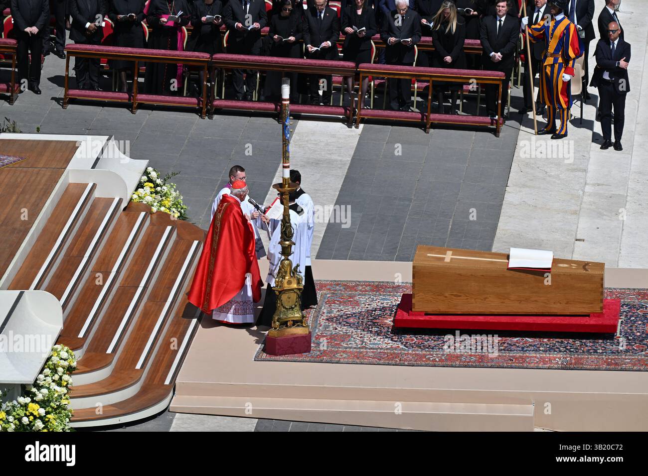 Italian cardinal Giovanni Battista Re officiates near the coffin of ...