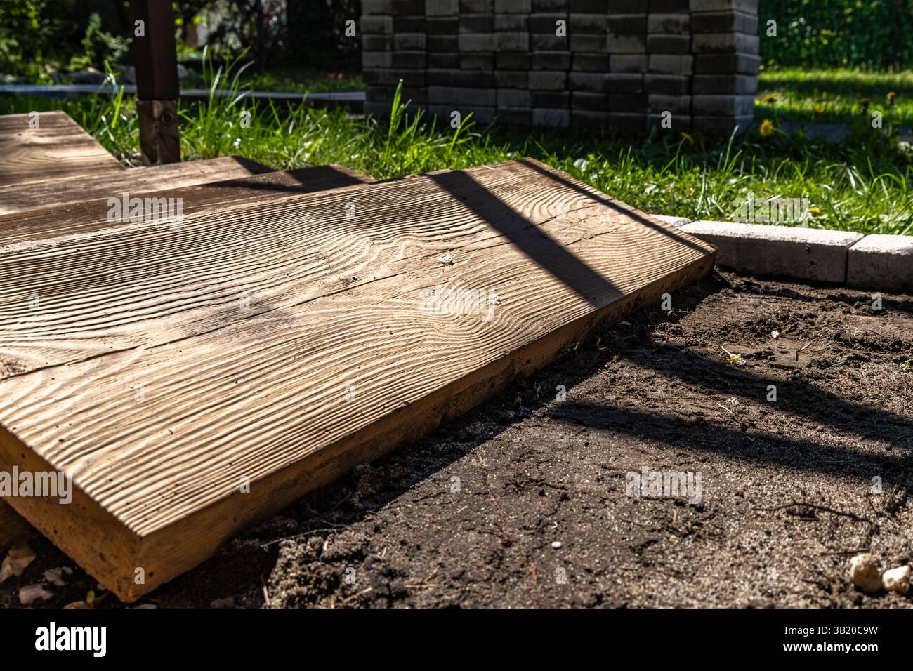 Dismantling of old paving slabs, construction of a veranda in the ...