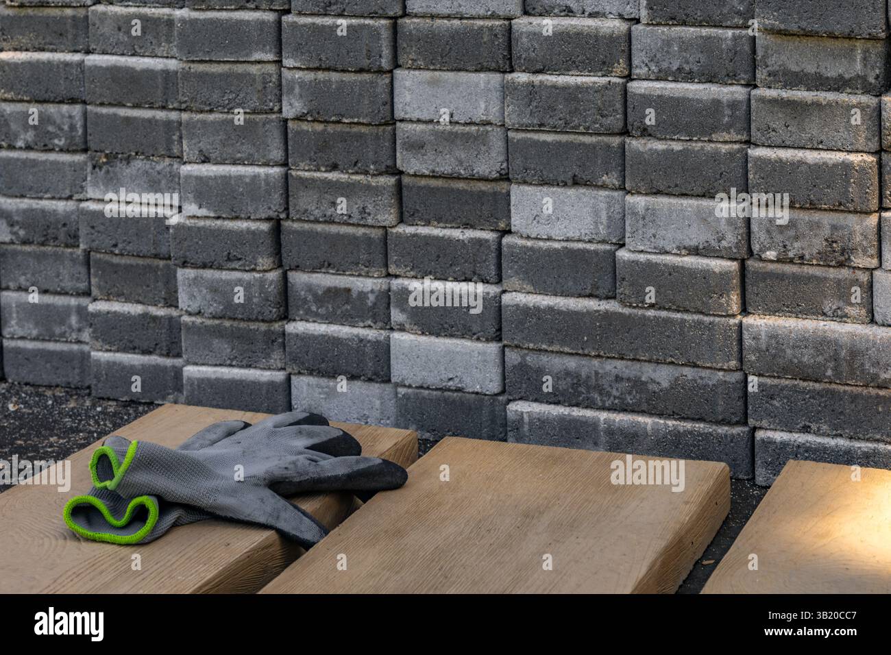 Gray granite cubes stacked in the garden, preparation for laying tiles ...