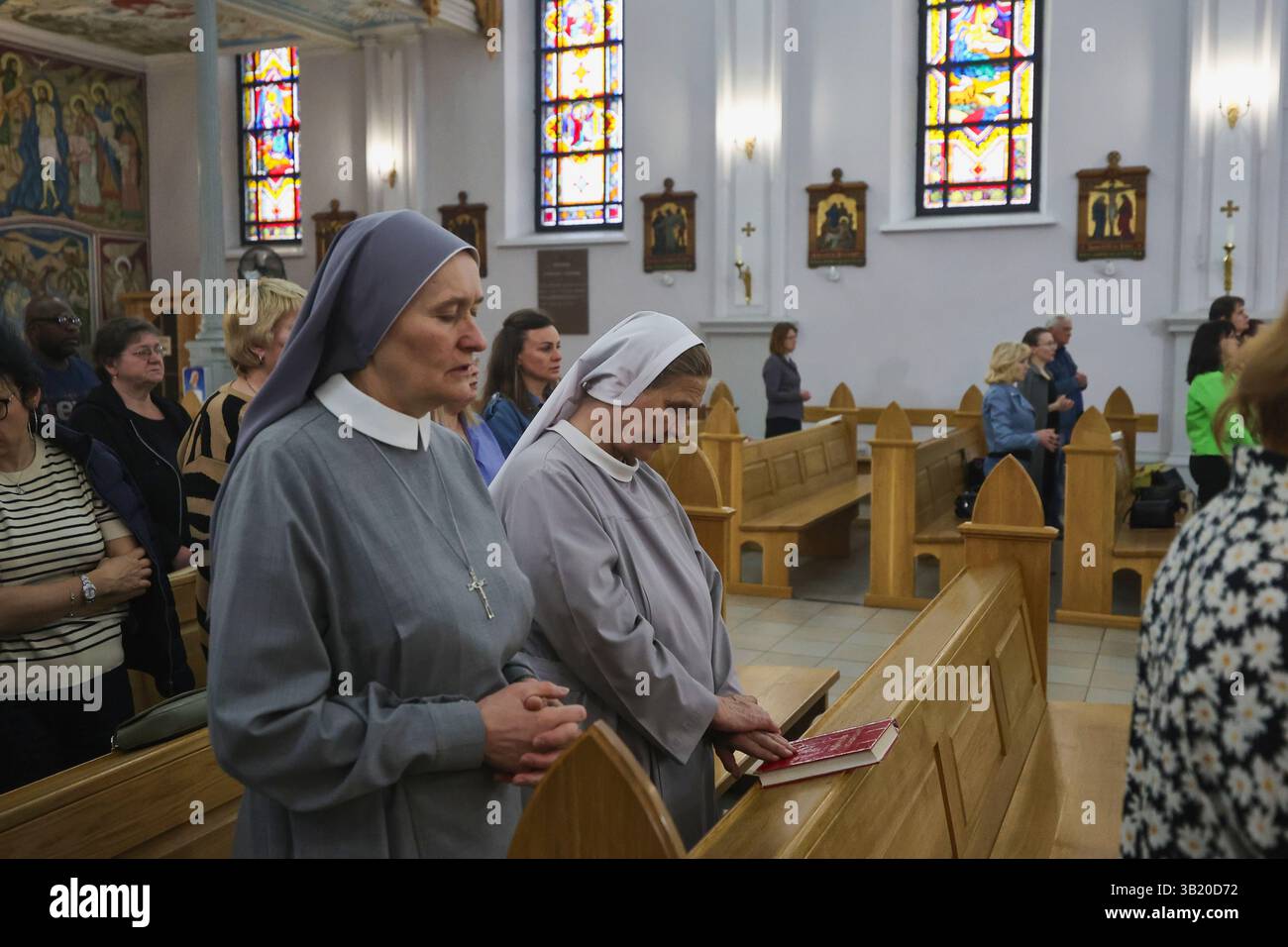 Non Exclusive: Devotees attend the holy mass in memory of late Pope ...