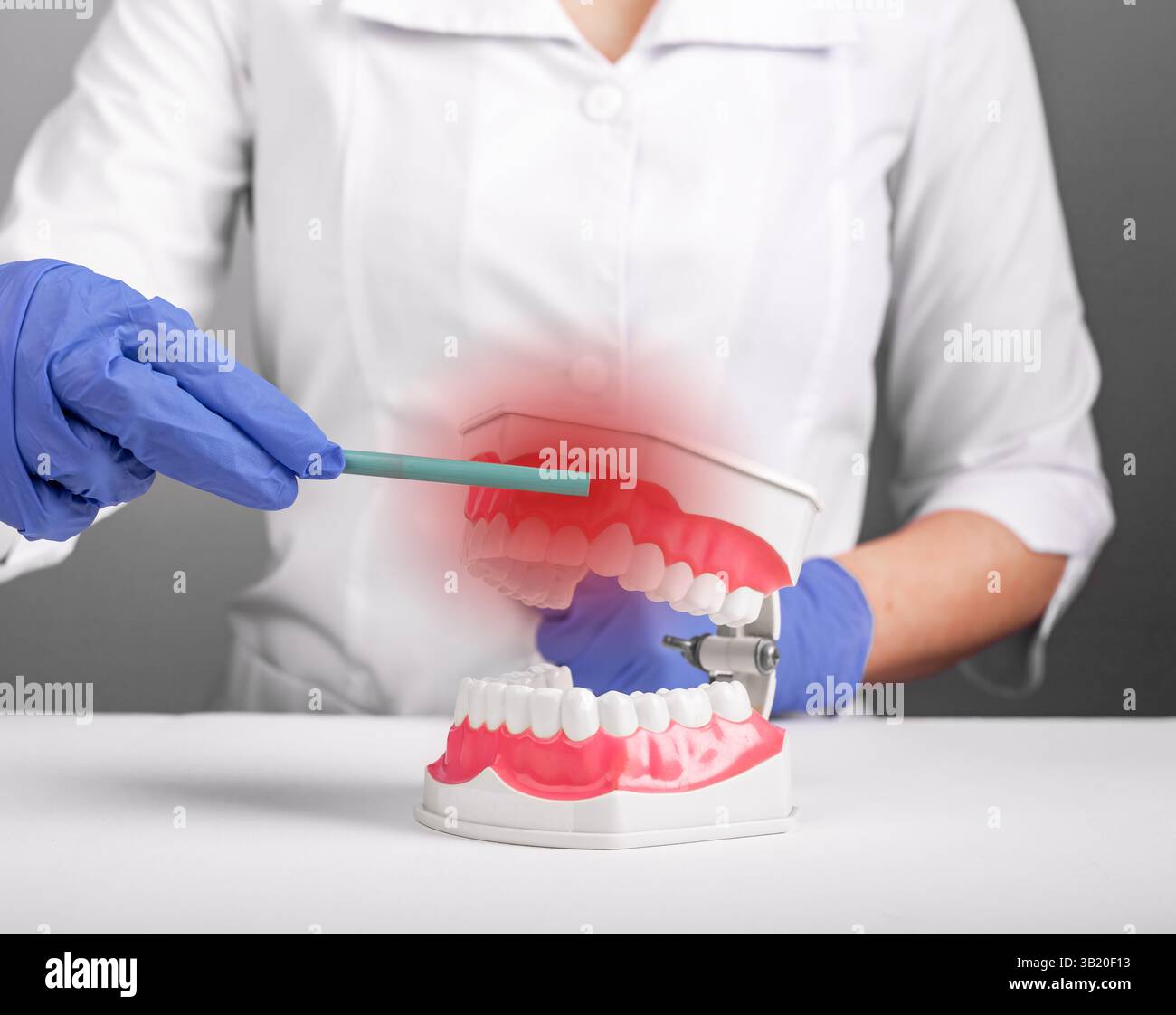 Gum inflammation. Woman pointing to mouth with red painful gingiva ...