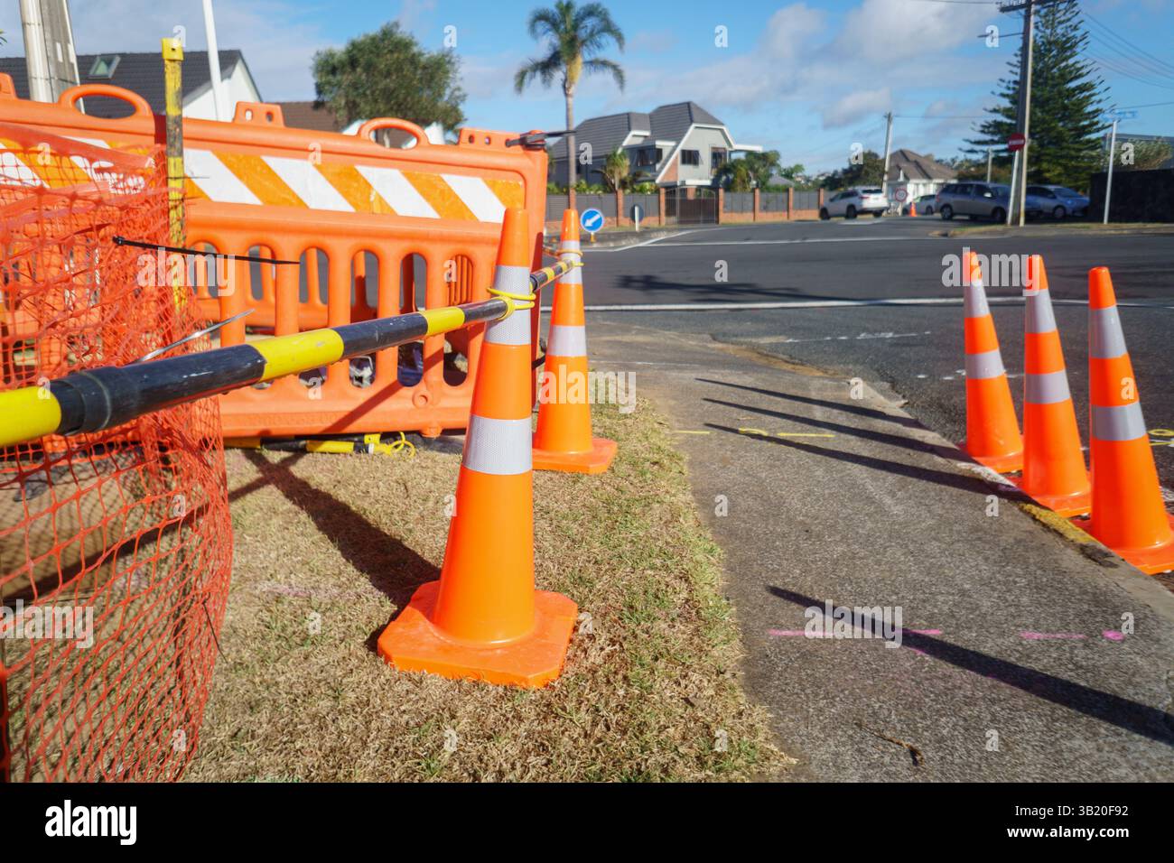 Traffic cones lining up the street. Barrier fences blocking the corner ...