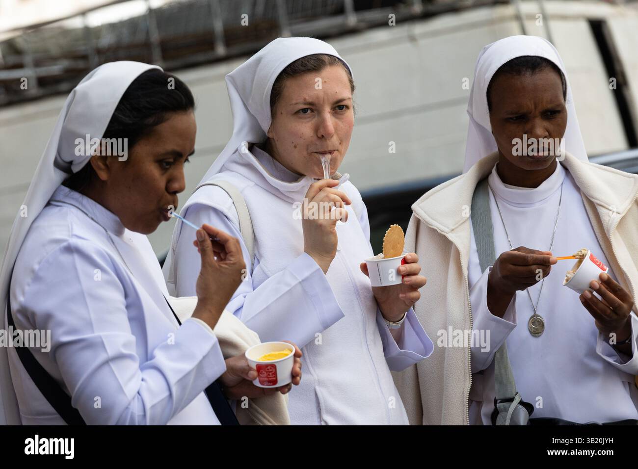 Rome, Italy. 26th Apr, 2025. Catholic nuns are seen enjoying ice cream amid the days of mourning ...