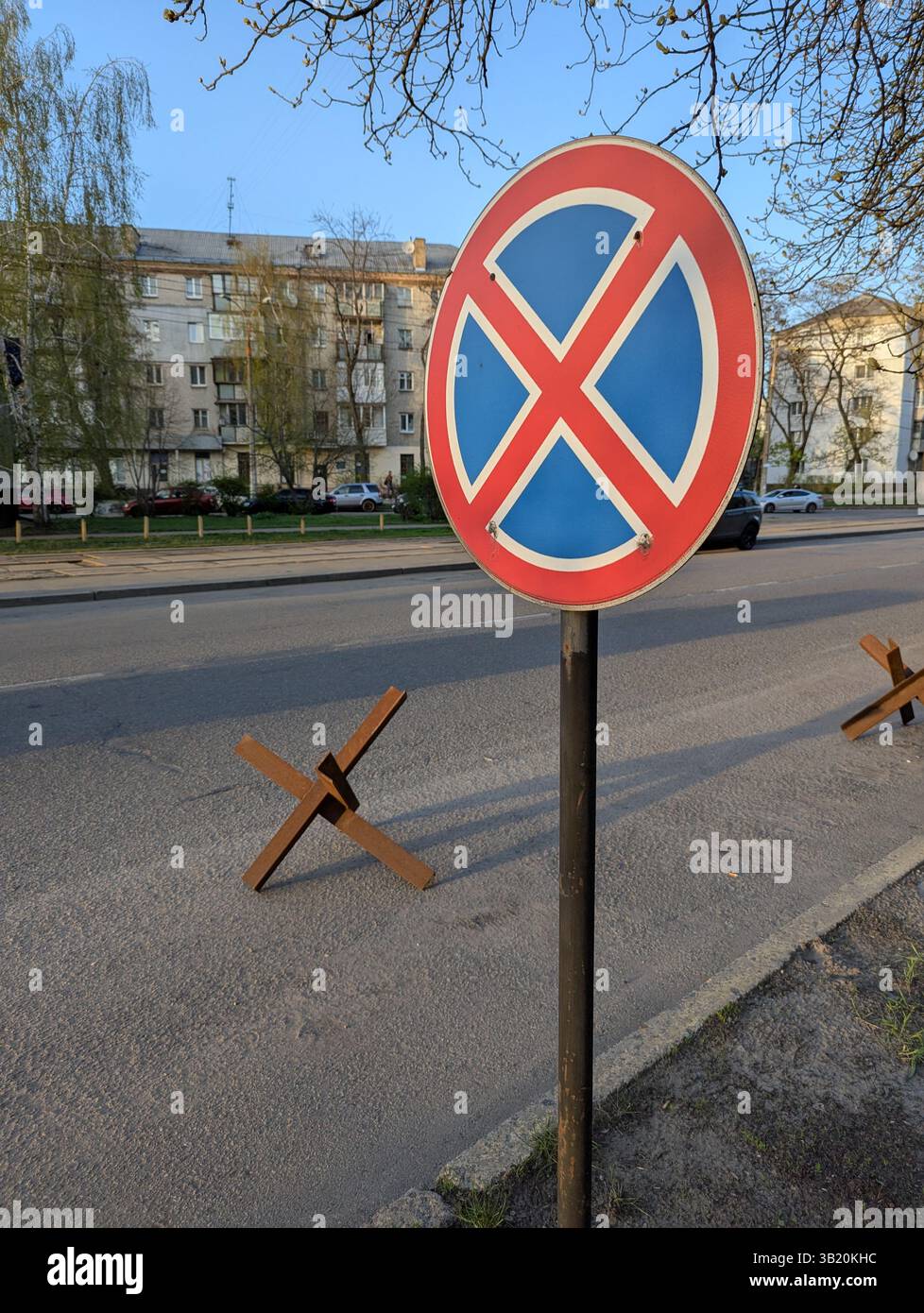 No stopping sign and Czech anti-tank hedgehogs on the road Stock Photo ...