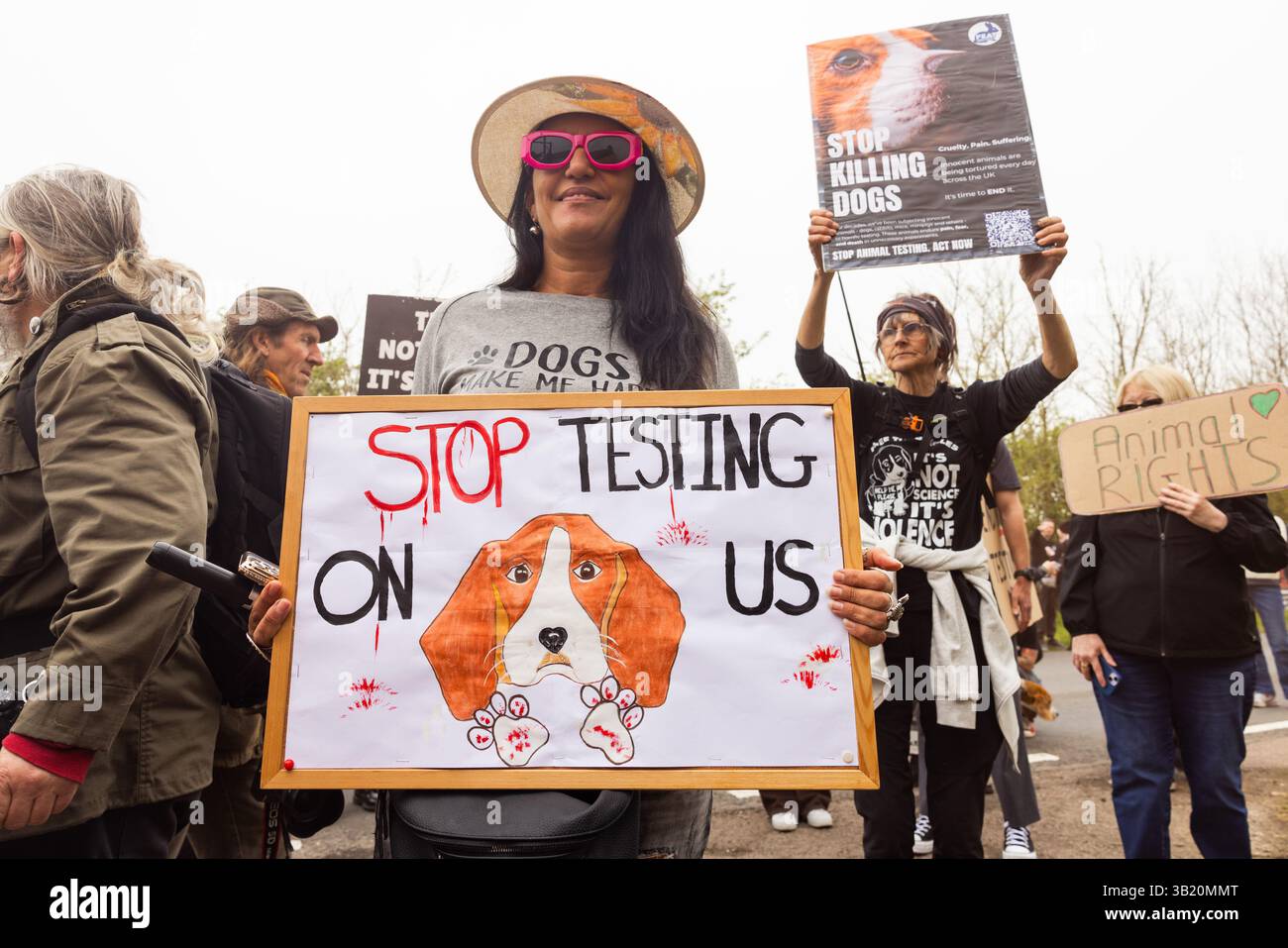 Huntingdon, UK. 26 APR, 2025. Lady holds "Stop testing on us" sign ...
