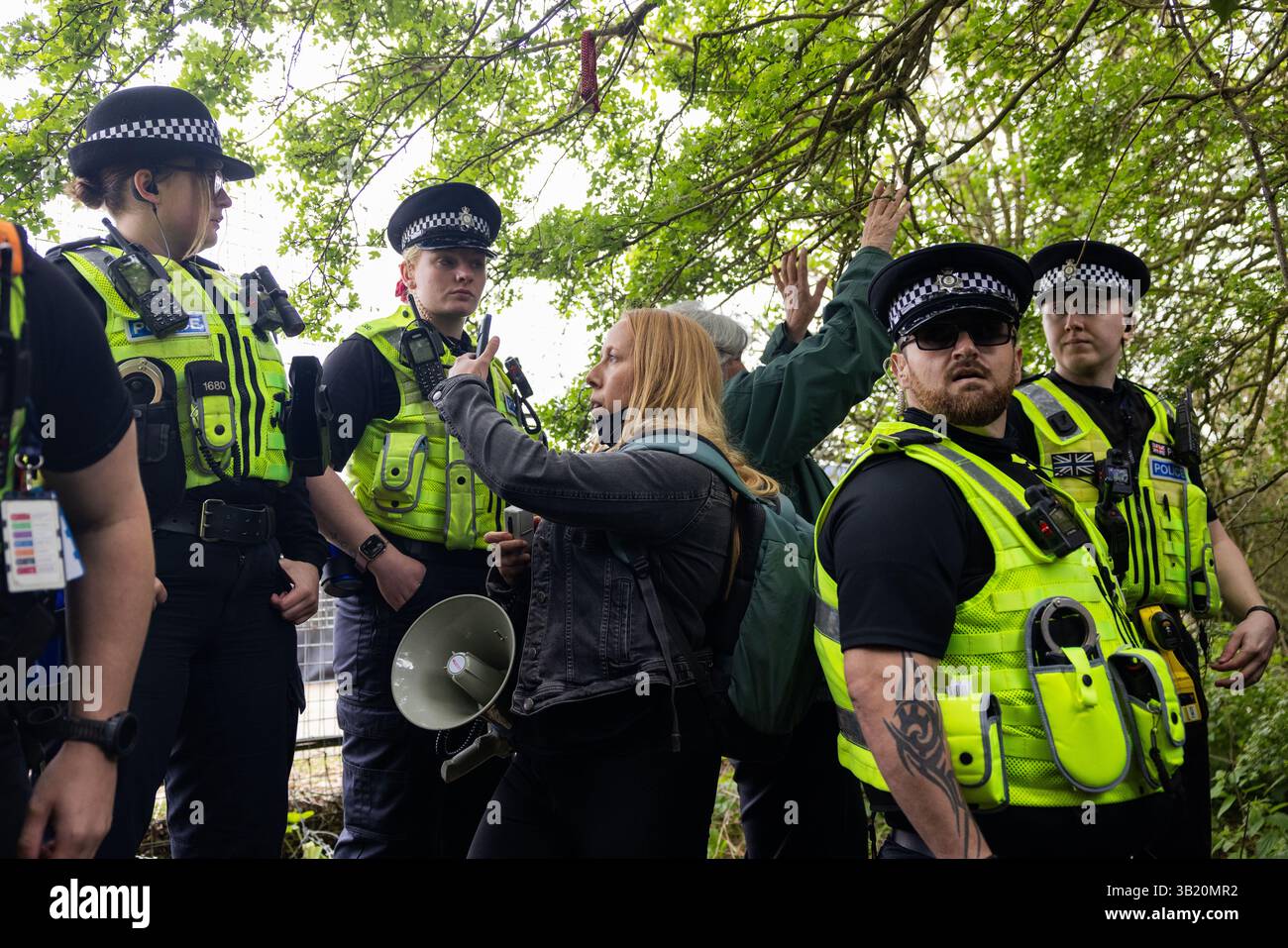 Huntingdon, UK. 26 APR, 2025. Lady films the police at a protest for ...