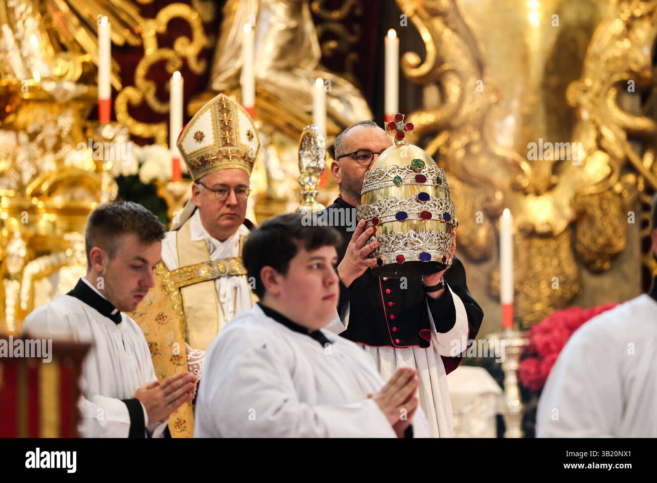 27 April 2025, Bavaria, Munich: Pastor Daniel Lerch wears a papal crown ...