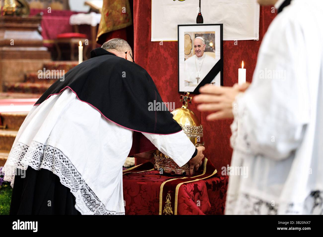 27 April 2025, Bavaria, Munich: Pastor Daniel Lerch wears a papal crown ...