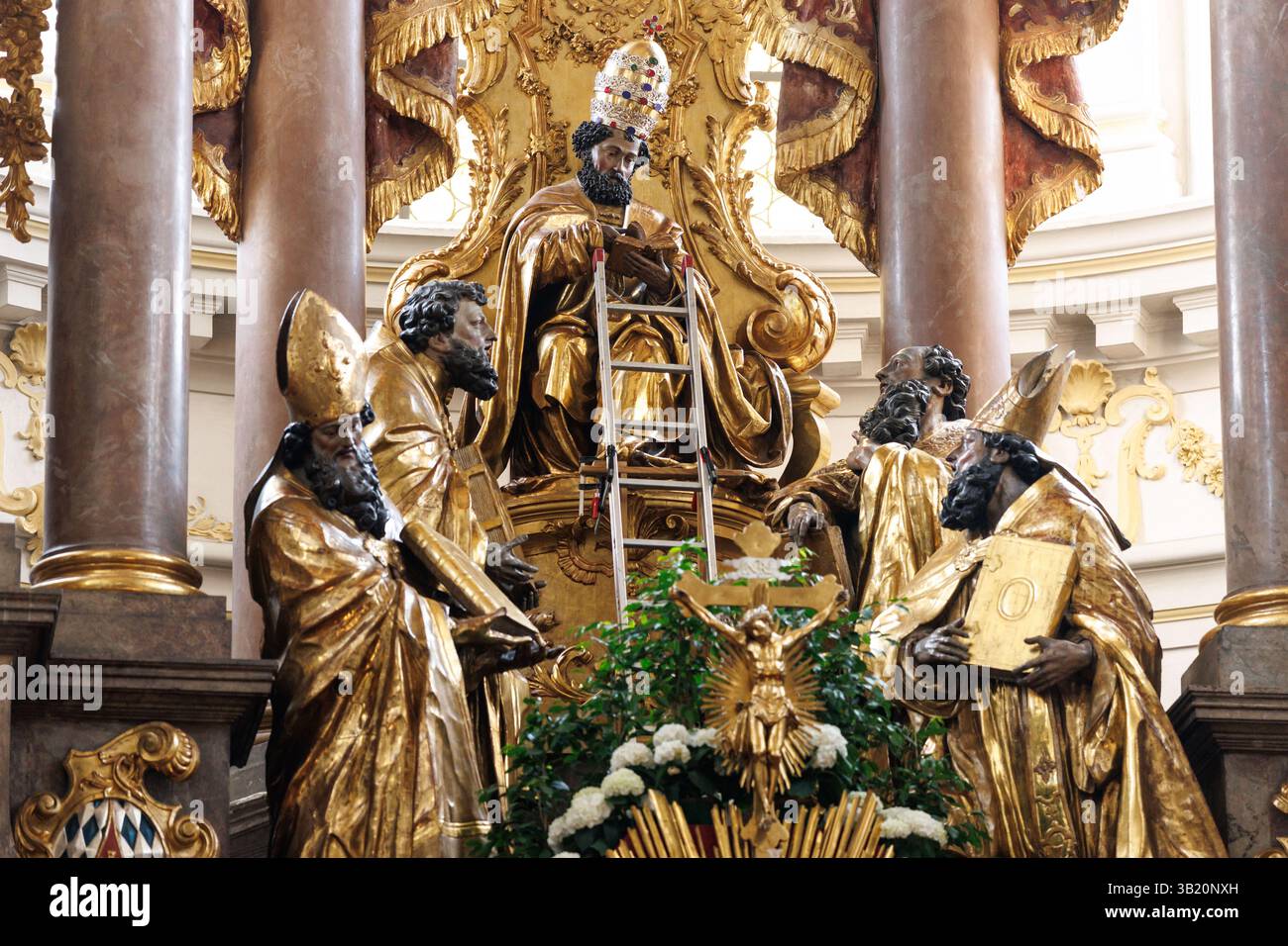 27 April 2025, Bavaria, Munich: A ladder leans against the figure of ...