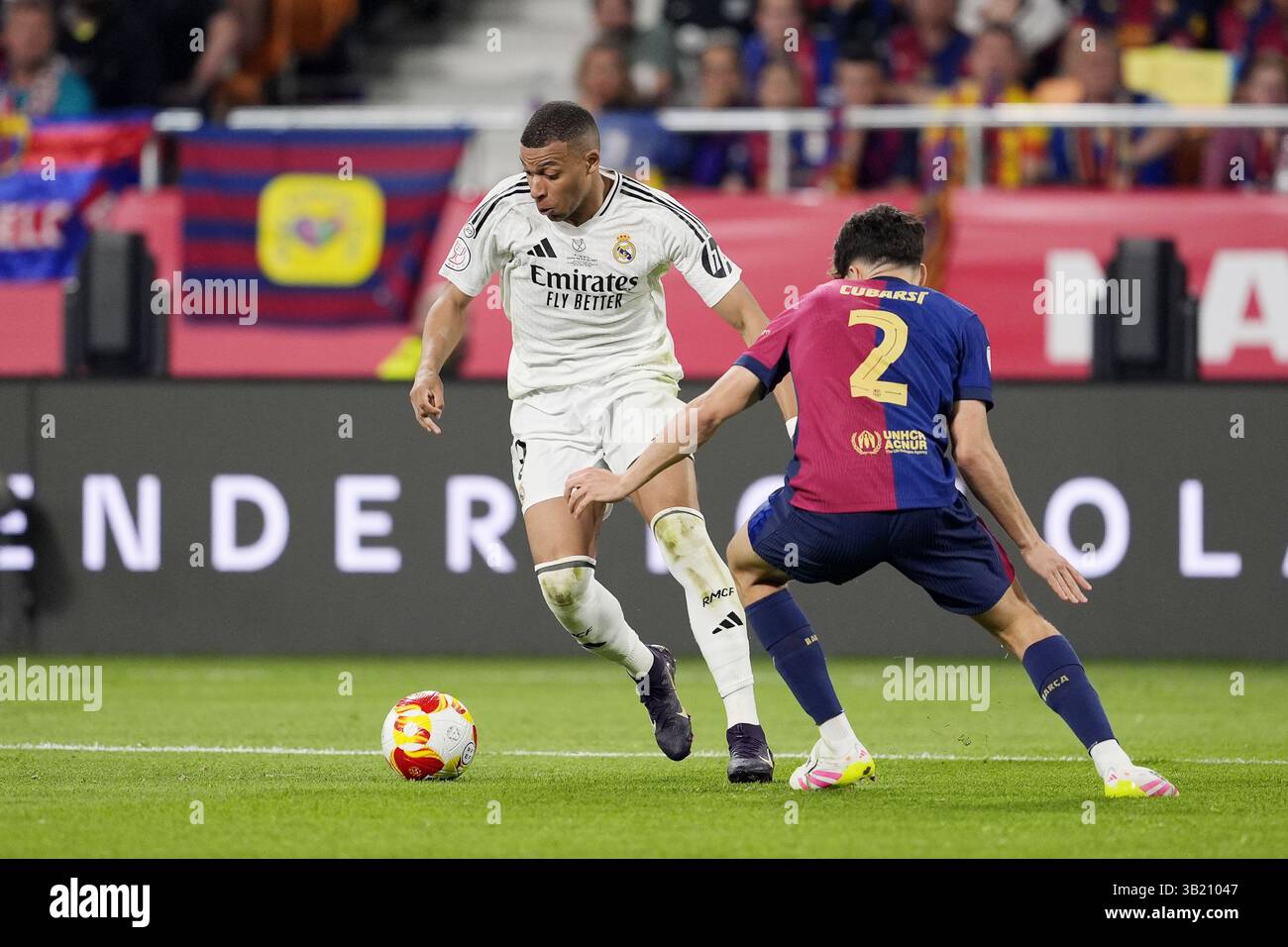 Kylian Mbappe of Real Madrid and Pau Cubarsi of FC Barcelona during the ...