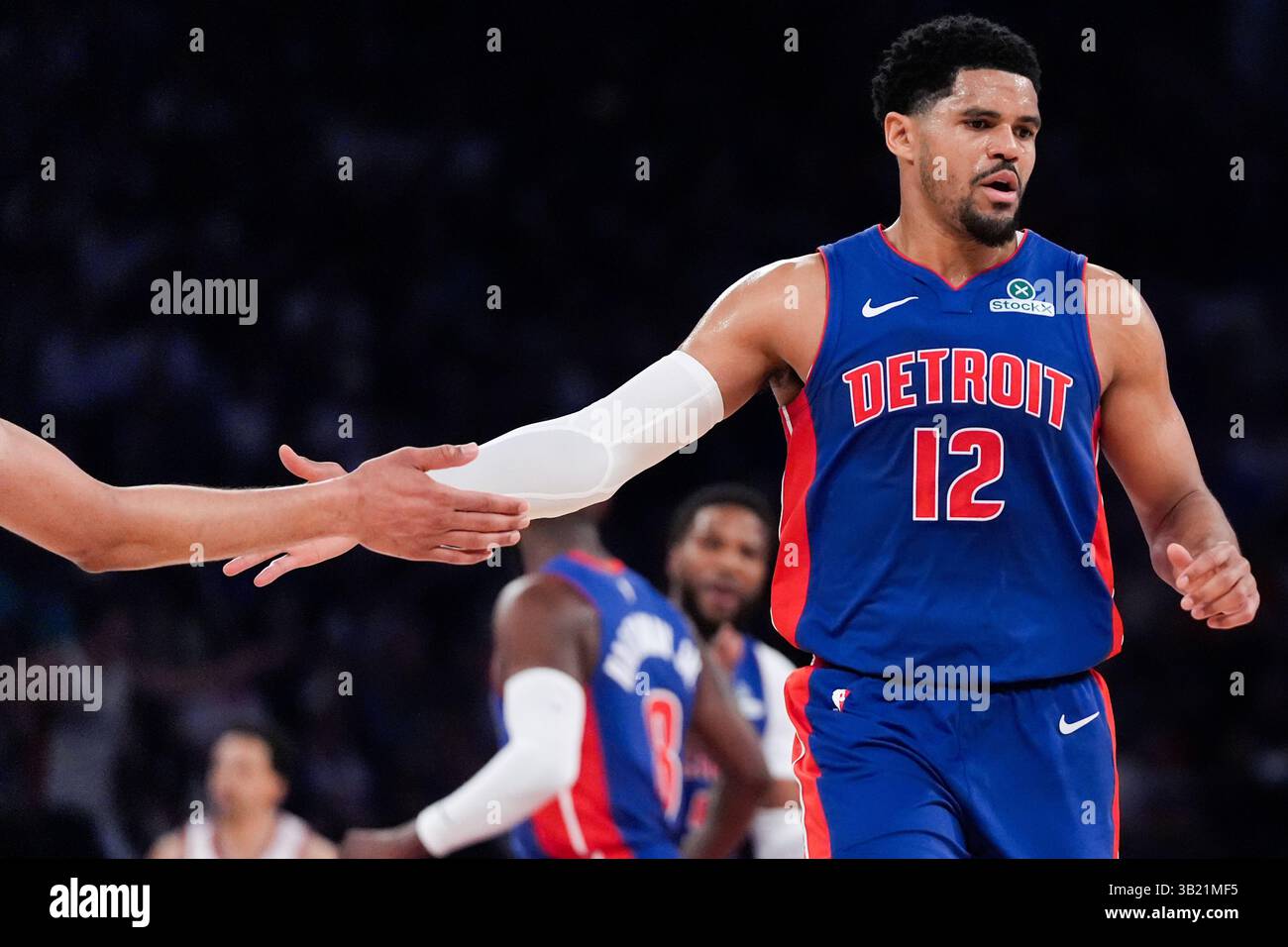 Detroit Pistons forward Tobias Harris low fives a teammate during Game ...