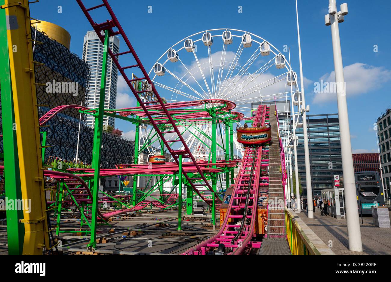Paying customers on the Spectacular Magic Mouse Roller Coaster in ...