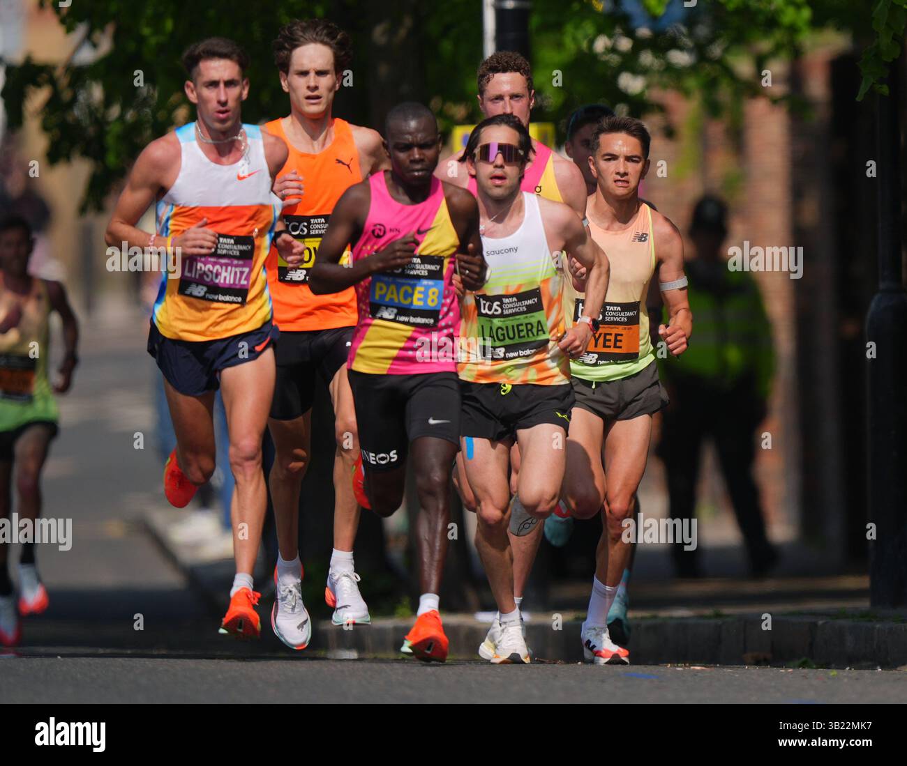 Men's elite runners, including Alex Yee, reach the Isle of Dogs, during ...