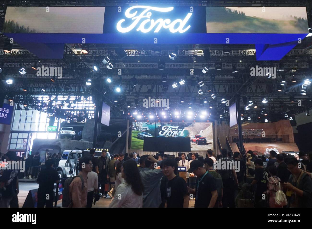 Visitors visit the Ford Motor Company booth at the 2025 Shanghai ...