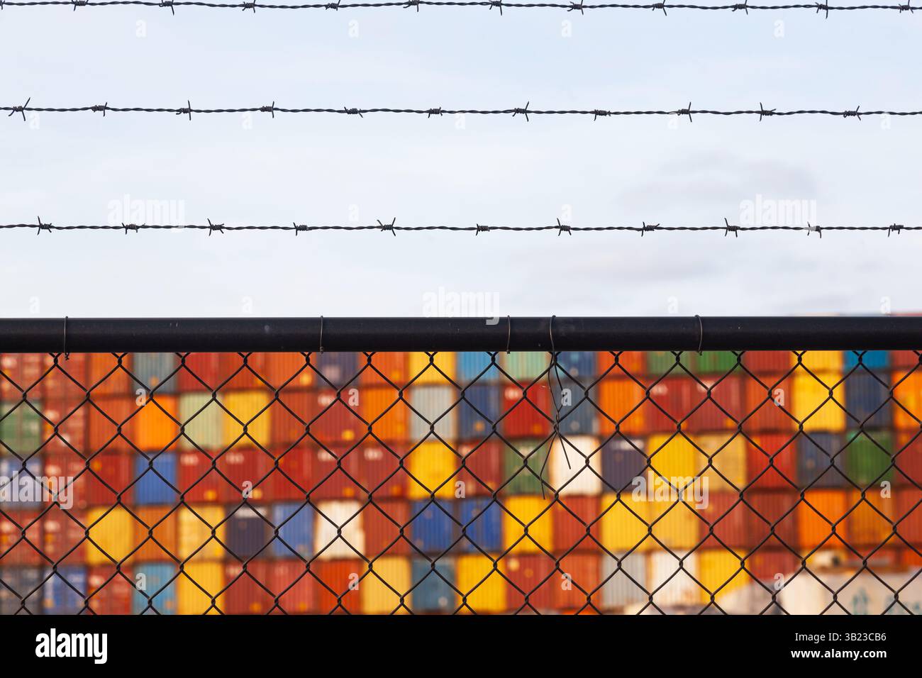 Stacked shipping containers stand in a closed area of the seaport of ...