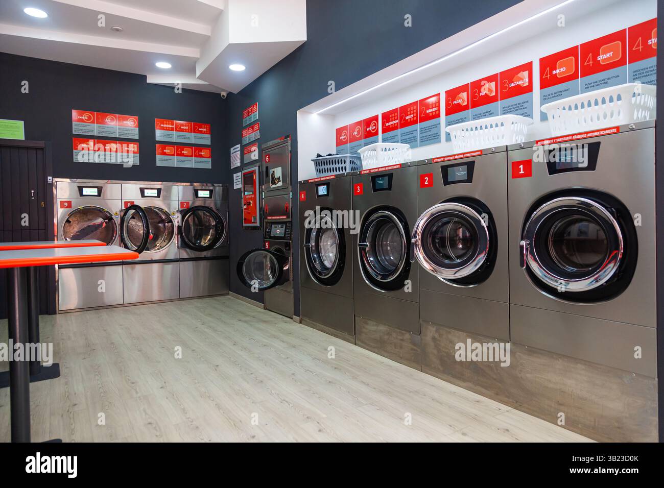 Professional washing machines installed in the city laundry Stock Photo ...