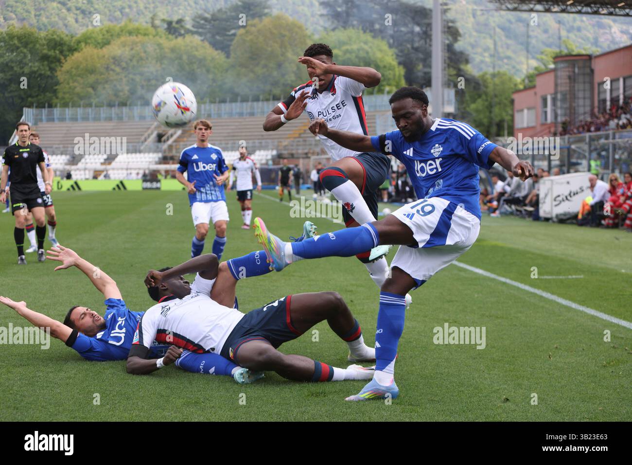 Como's Jonathan Ikone, right, clears the ball during the Serie A soccer ...