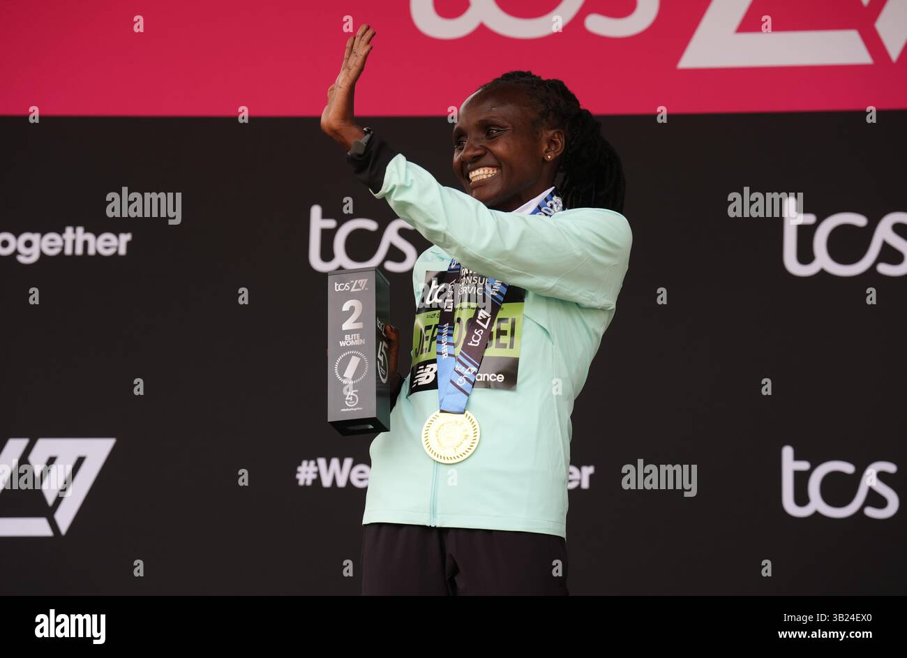 Joyciline Jepkosgei poses with her trophy after finishing second in the ...