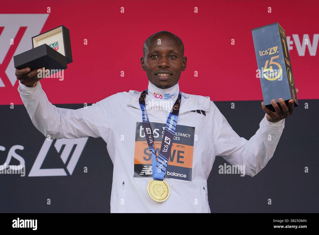 Sabastian Sawe of Kenya poses with is medal for winning the men's race ...
