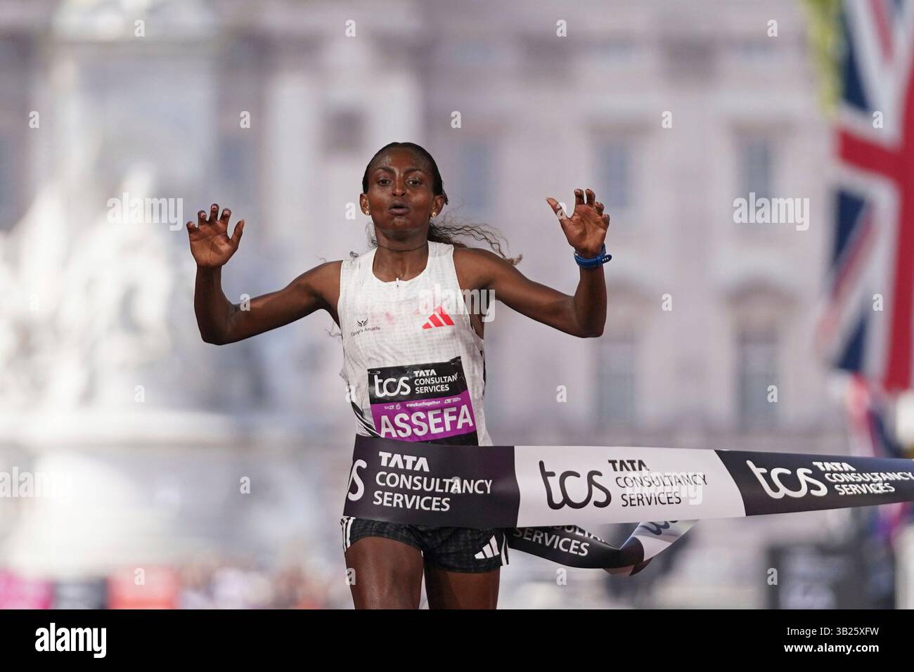 Tigst Assefa crosses the line to win the women's race at the London ...
