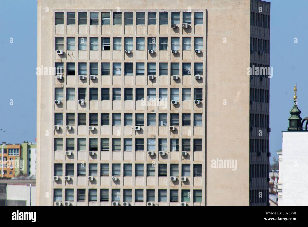 Close-up view of an old office building facade featuring repetitive ...