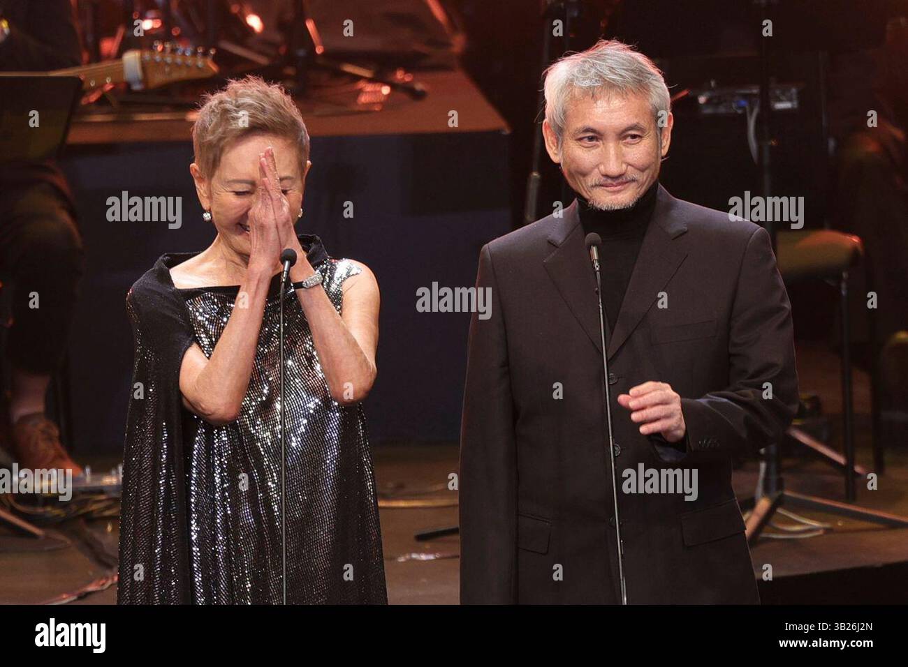 Nansun Shi, left and Tsui Hark react as they receive their Lifetime ...