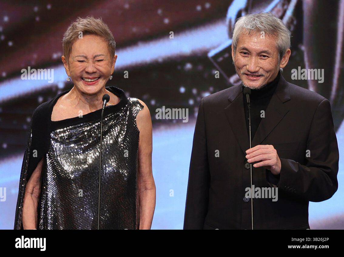 Nansun Shi, left and Tsui Hark react as they receive their Lifetime ...