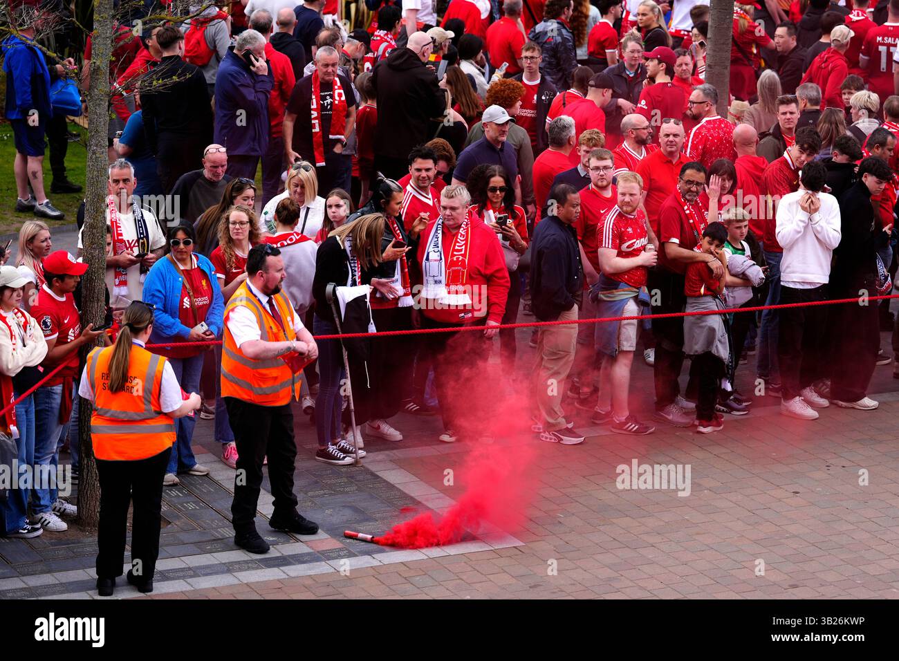 Staff attempt to extinguish a flare that has been set off outside the ...