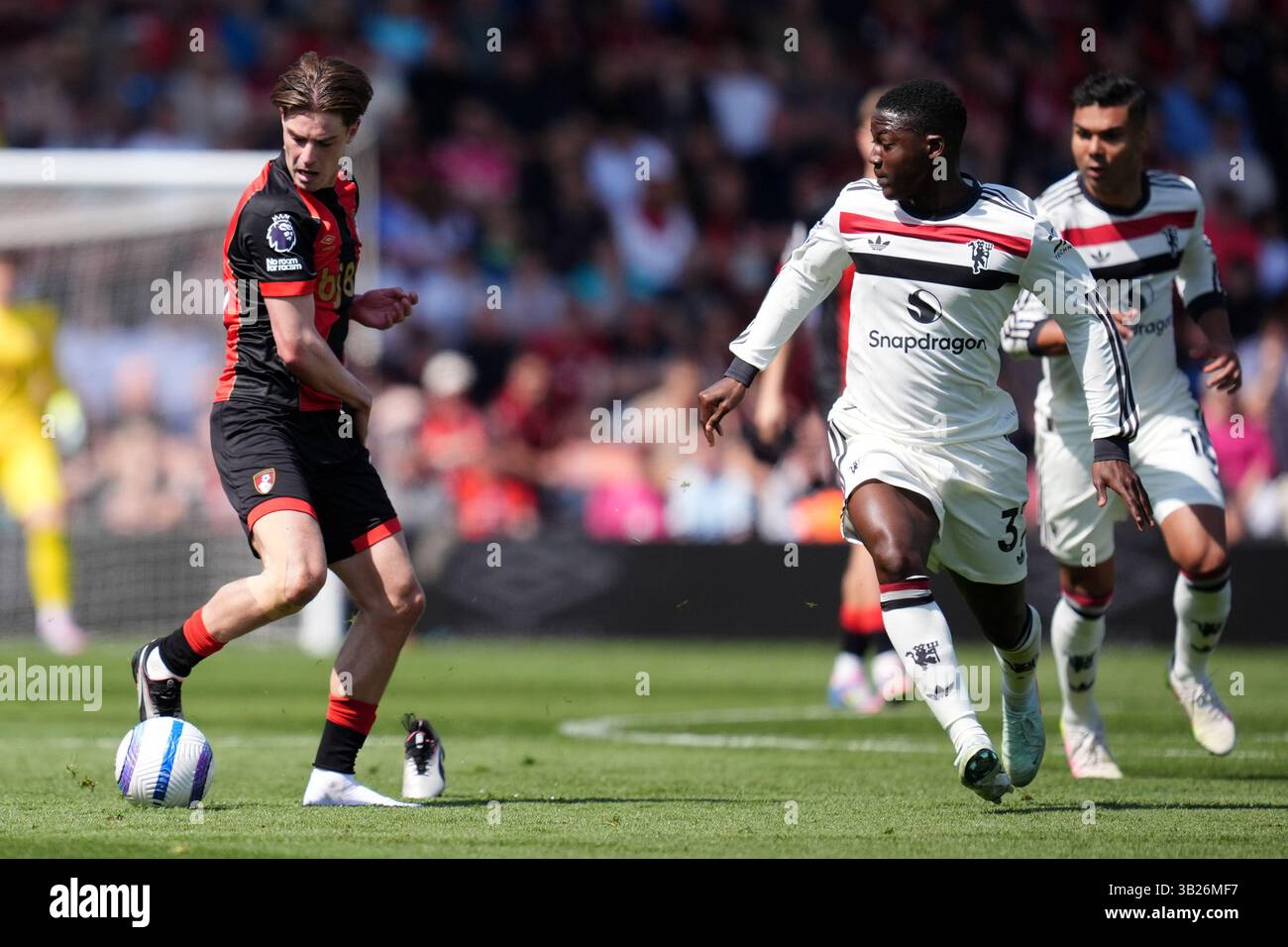 Bournemouth's Alex Scott (left) and Manchester United's Kobbie Mainoo ...