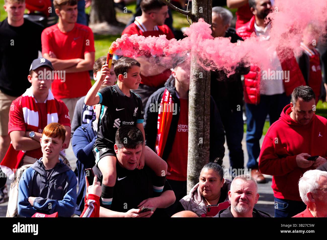 Liverpool fans set off flares outside the ground ahead of the Premier ...