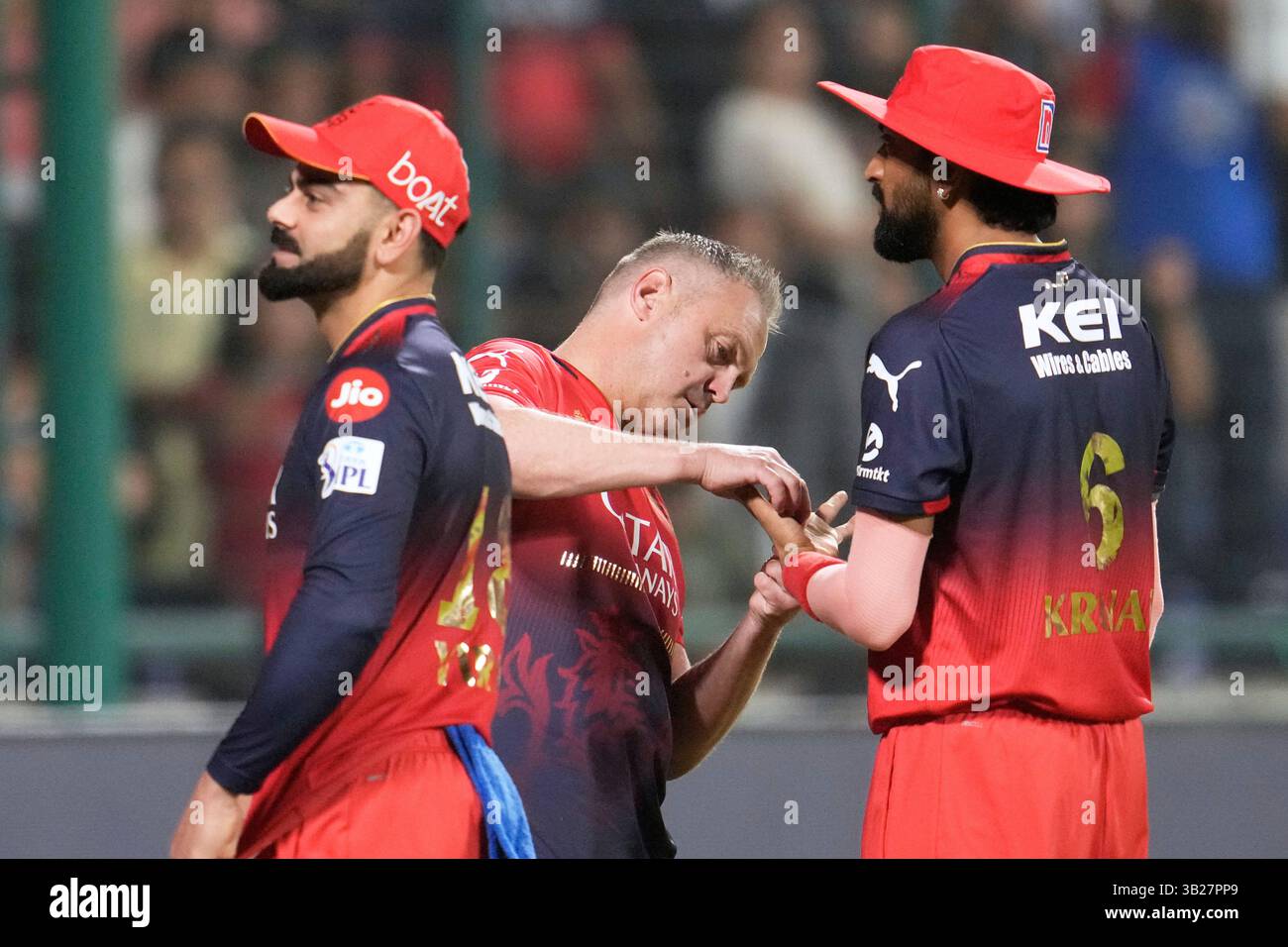 Royal Challengers Bengaluru's Krunal Pandya, right, gets a plaster on ...