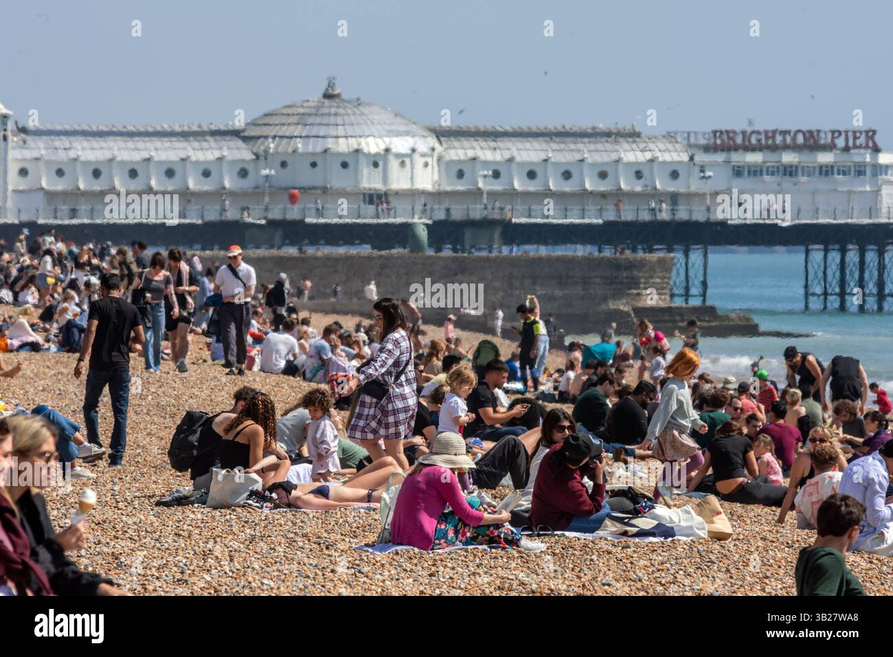 Brighton, April 27th 2025: Crowds on Brighton ebach enjoying the ...