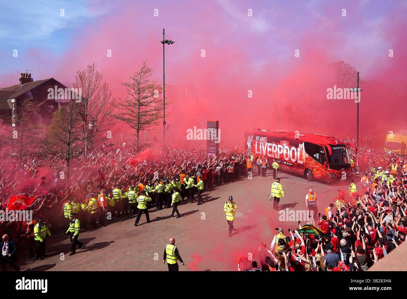 Fans react as the Liverpool team coach arrives ahead of the Premier ...