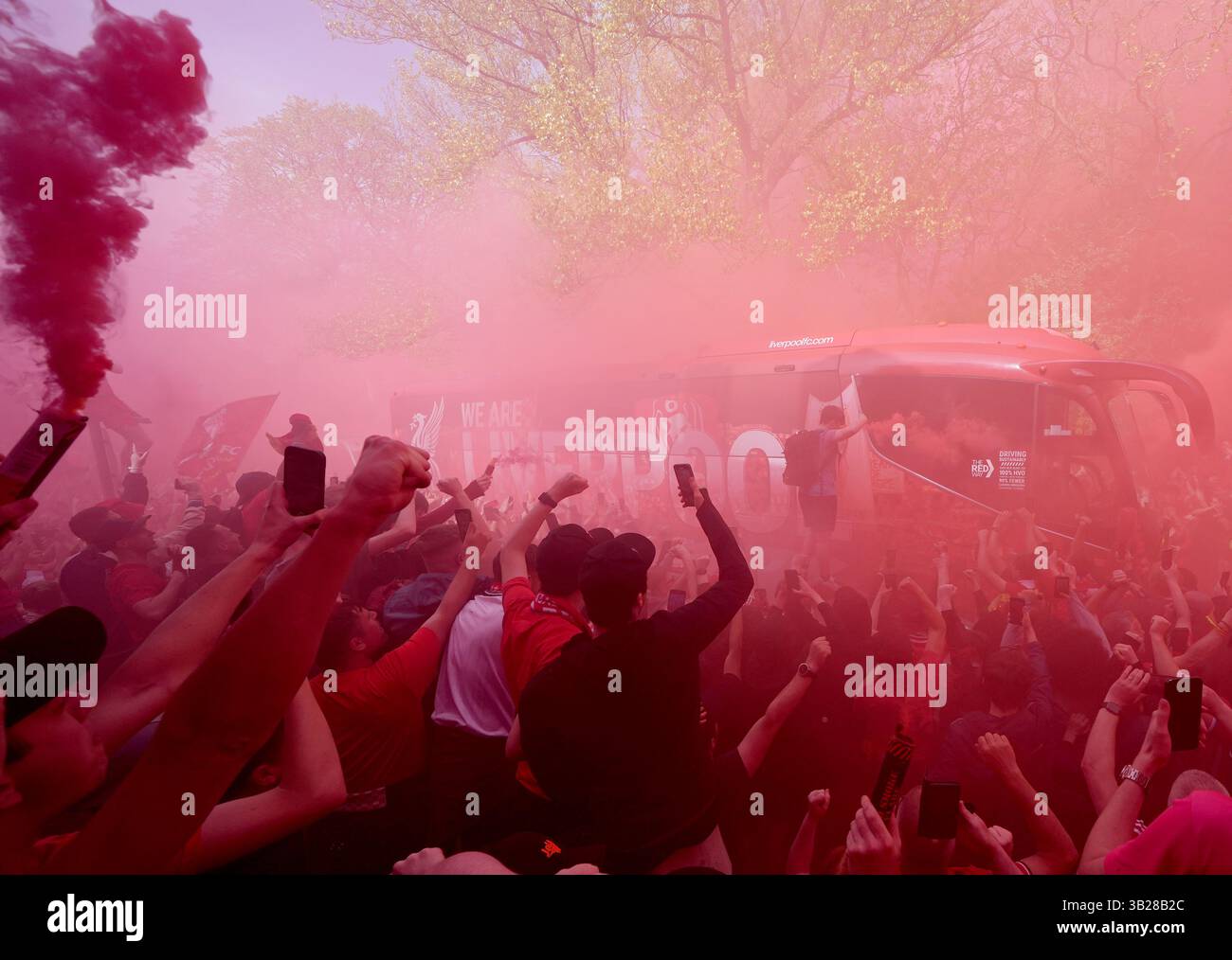 Liverpool fans greet their teams bus as it arrives at the ground ...