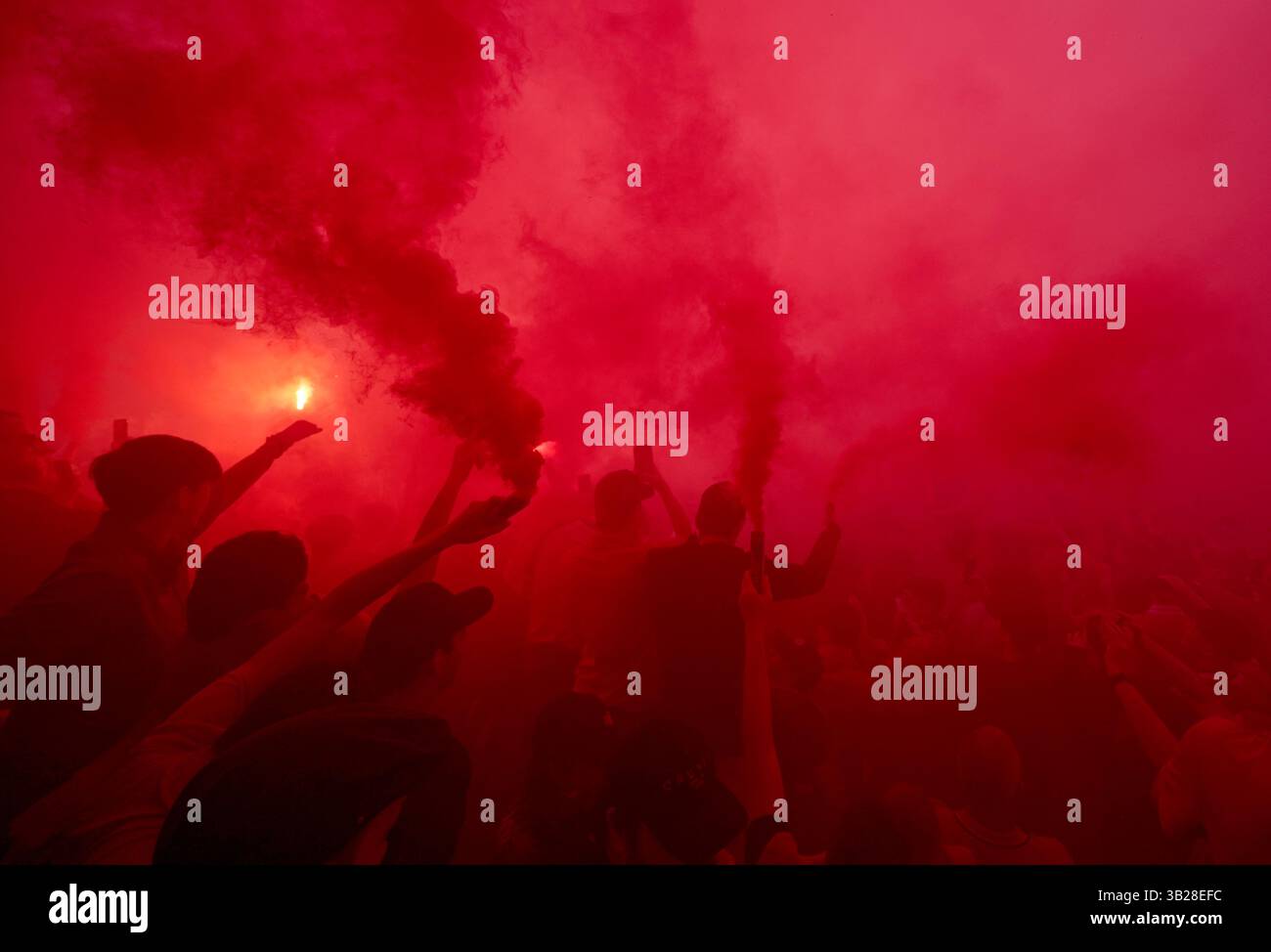 Liverpool fans set off flares outside the ground ahead of the Premier ...
