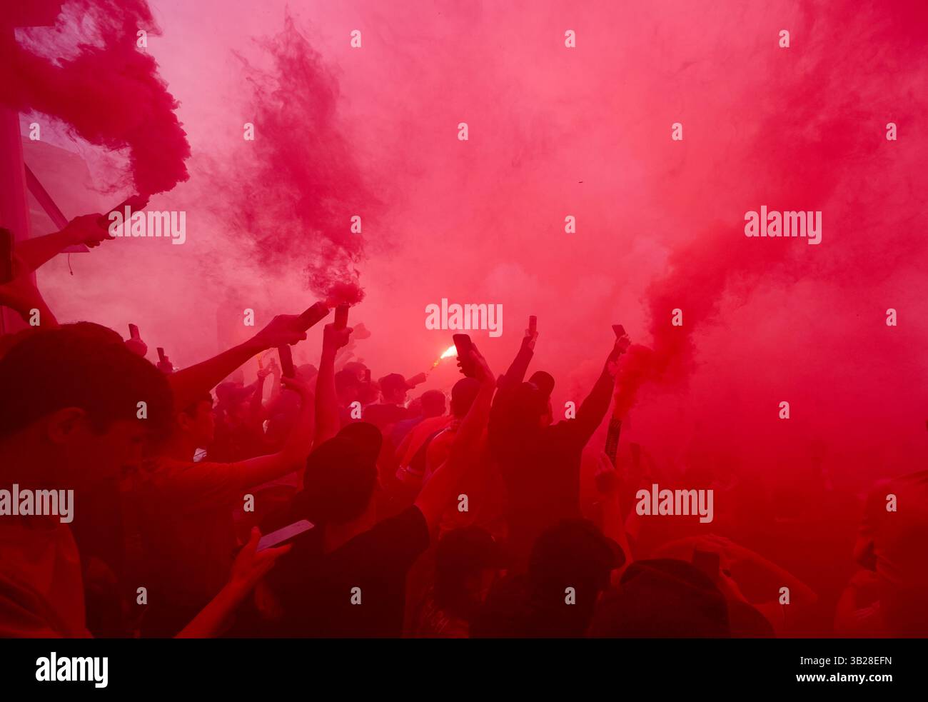 Liverpool fans set off flares outside the ground ahead of the Premier ...