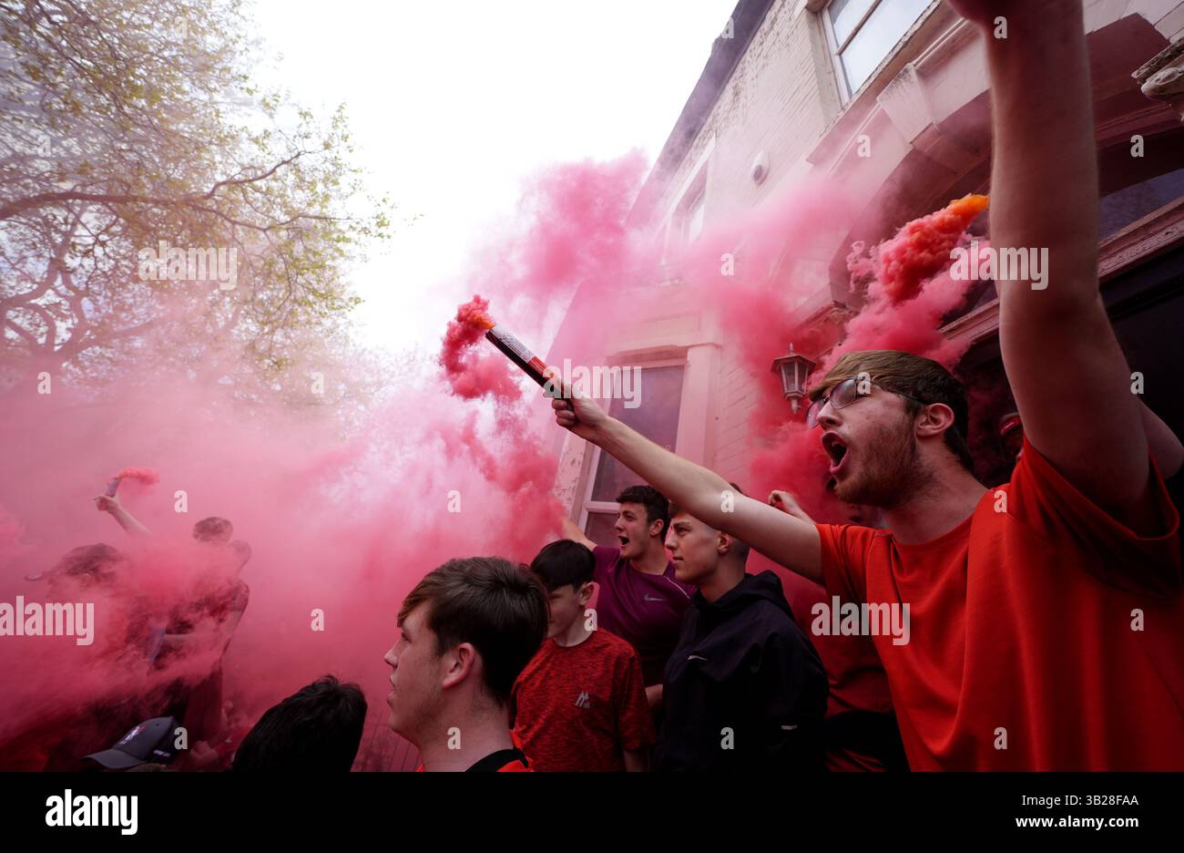 Liverpool fans set off flares outside the ground ahead of the Premier ...