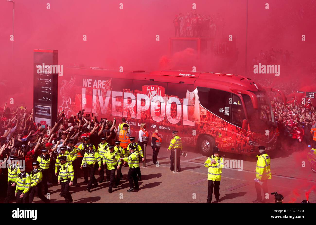 A general view as fans react to the Liverpool team coach arriving ahead ...