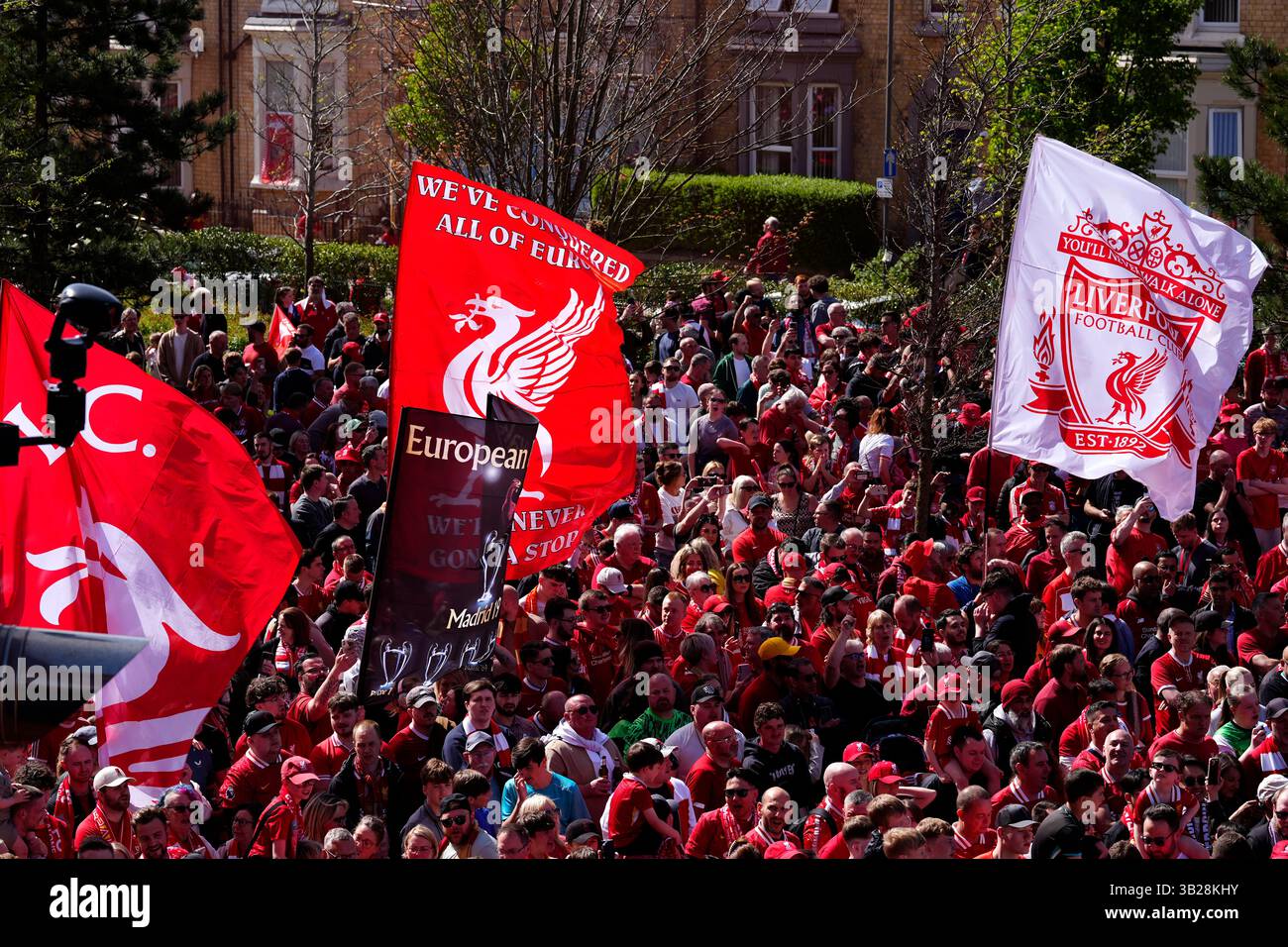 Liverpool fans flag large flags outside the stadium ahead of the ...