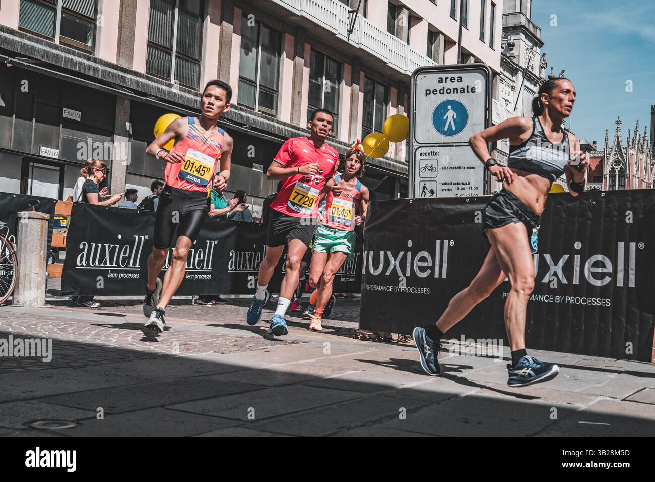 Enock Onchari wins the Padova Marathon 2025, crossing the finish line cheered by spectators ...