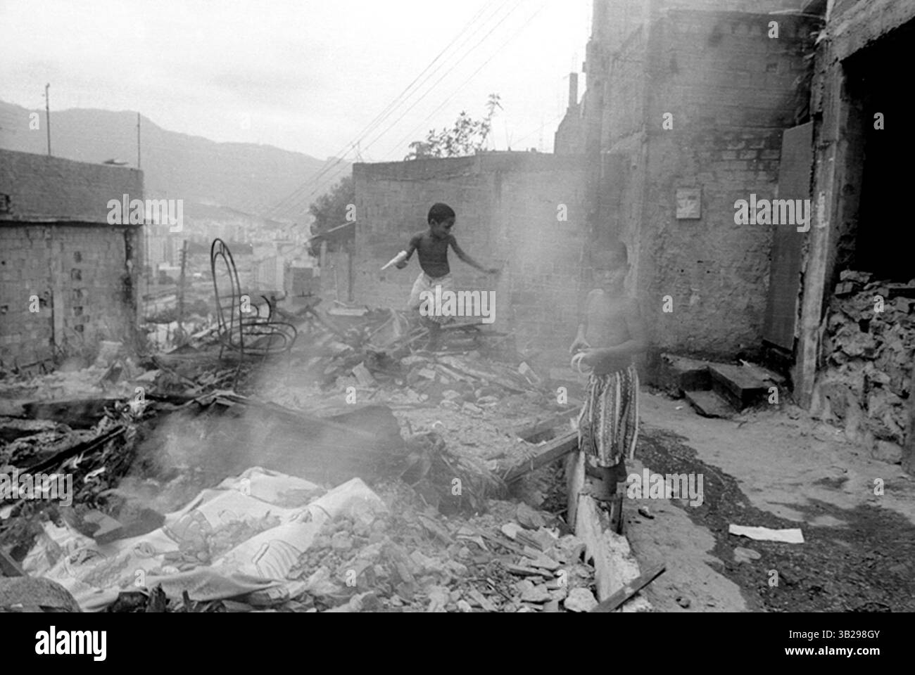 Feb 23, 1998 - Rio de Janeiro, Brazil - Boys play on a house that still ...