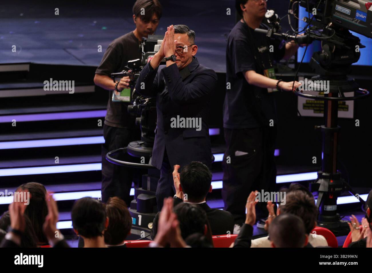 Soi Cheang reacts after being awarded the Best Director award for the ...