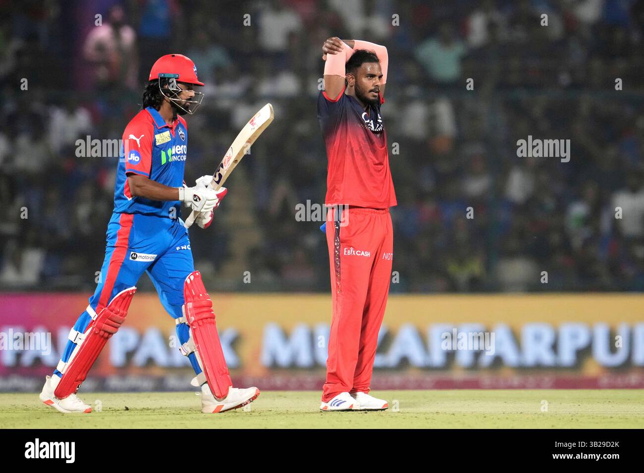 Royal Challengers Bengaluru's Yash Dayal, right, reacts after being hit ...