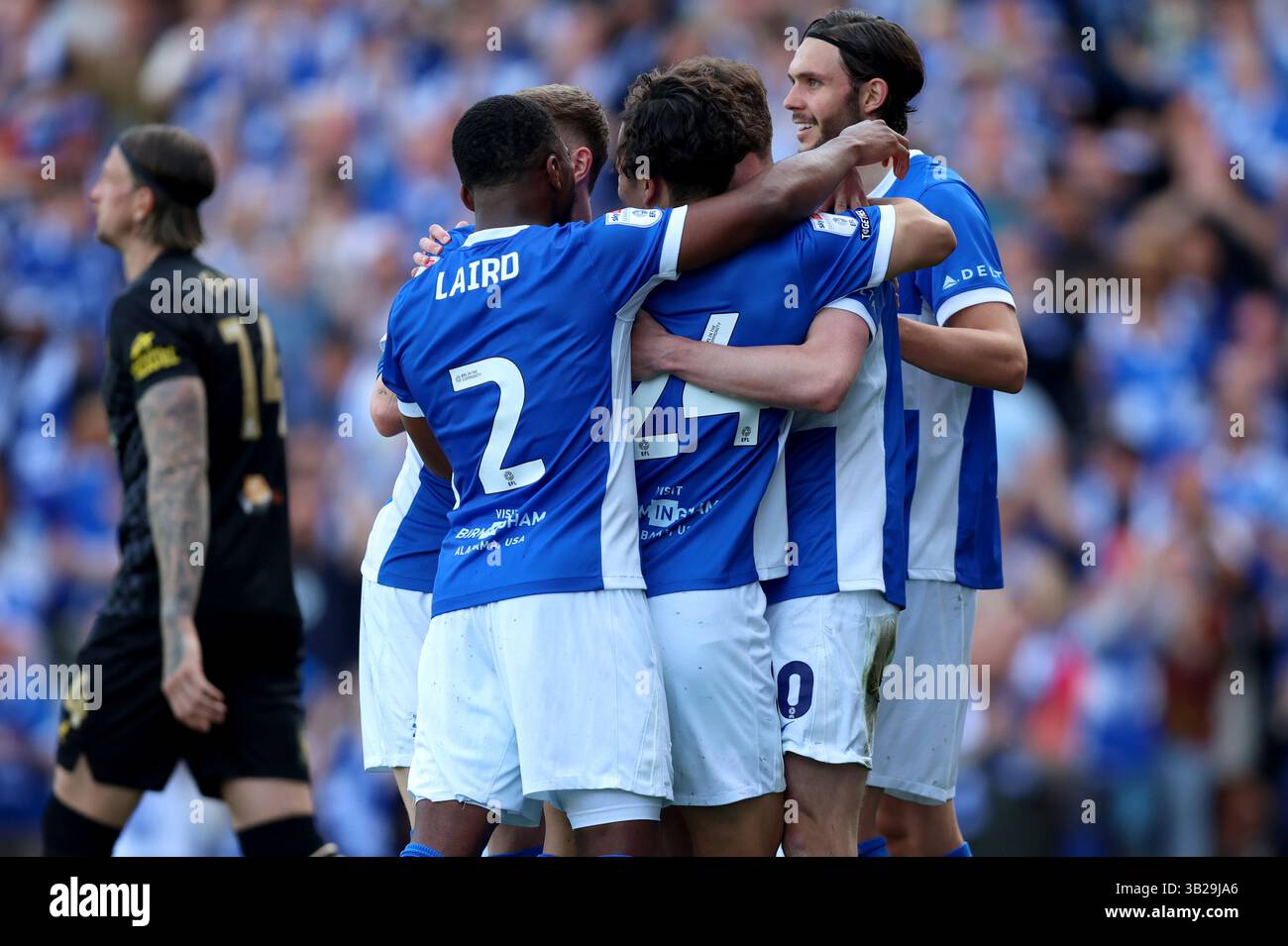 Birmingham City's Kieran Dowell (obscured) is mobbed by his team mates ...