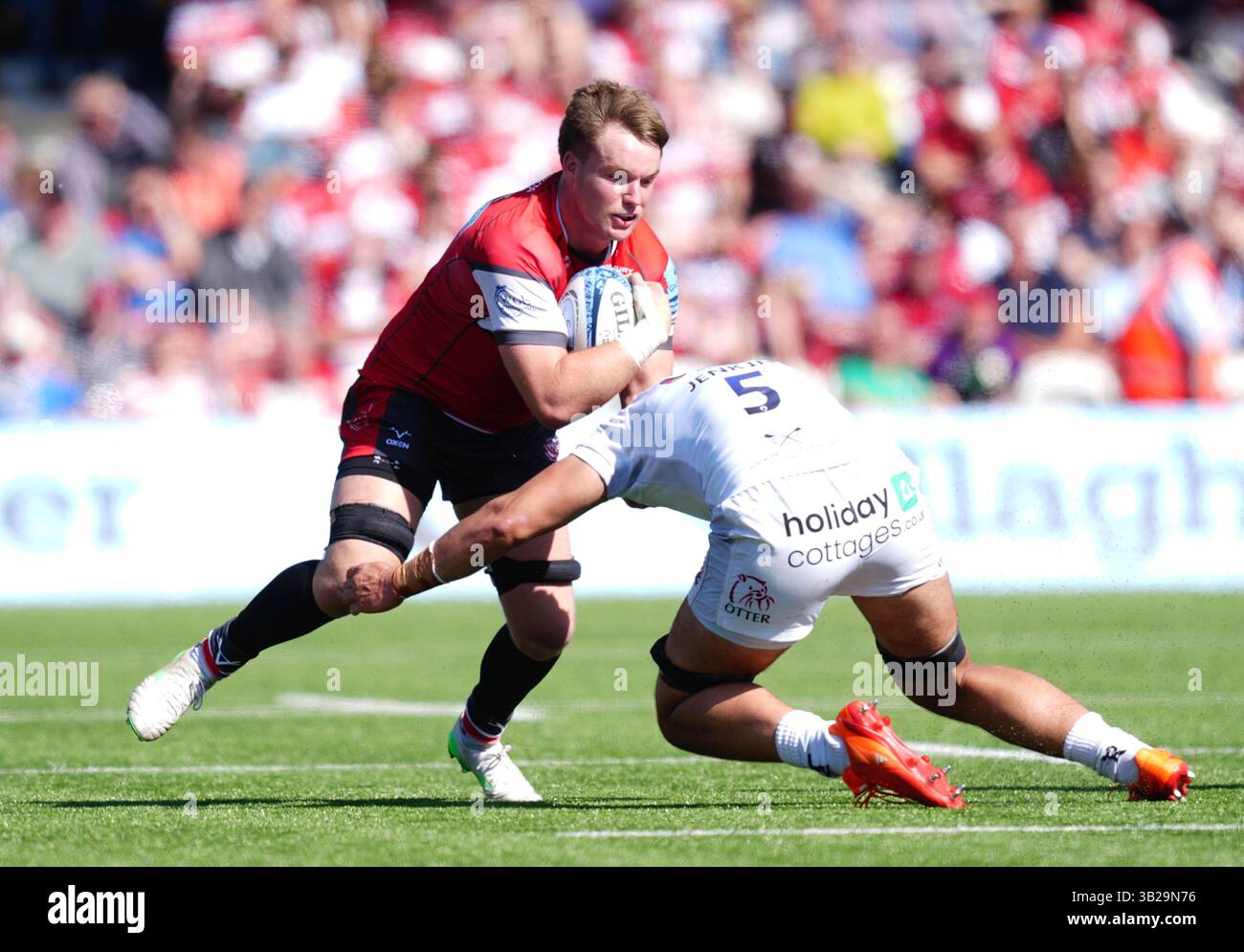 Gloucester's Jack Clement is tackled by Exeter Chiefs' Dafydd Jenkins ...
