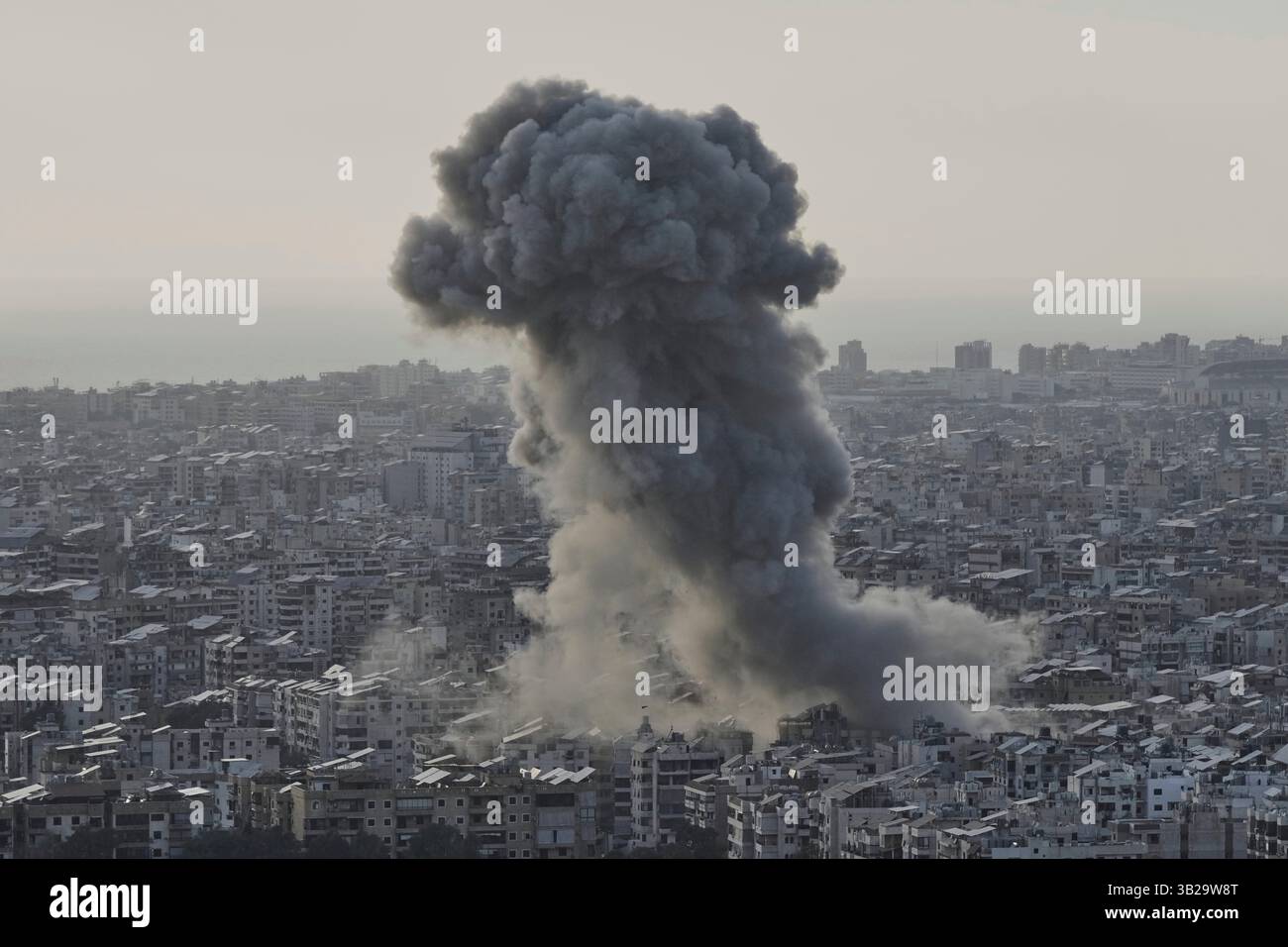 Smoke rises following an Israeli airstrike on Dahiyeh in the southern ...