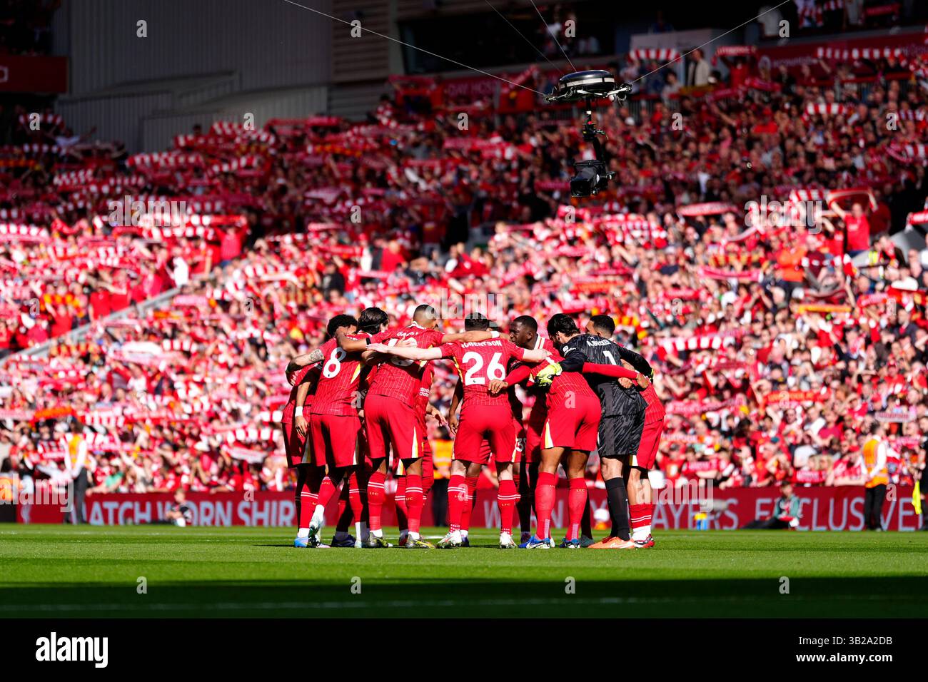 Liverpool players form a huddle ahead of the Premier League match at ...