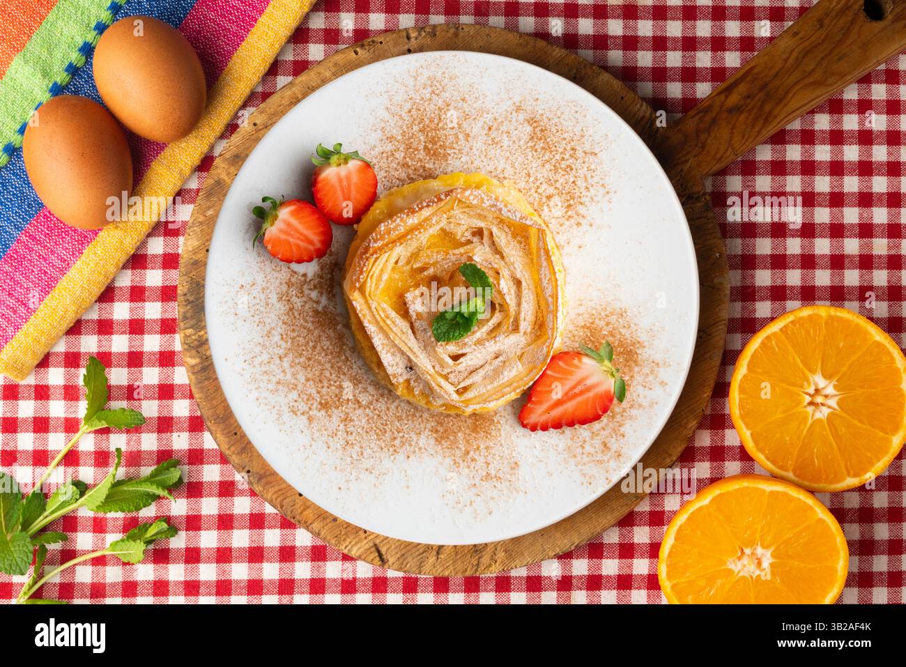 Flower-shaped tart made with filo pastry filled with cream. Top view ...